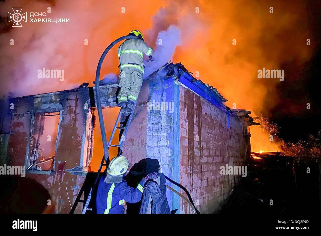 Ukrainian firefighters work at the scene of a Russian attack that ...