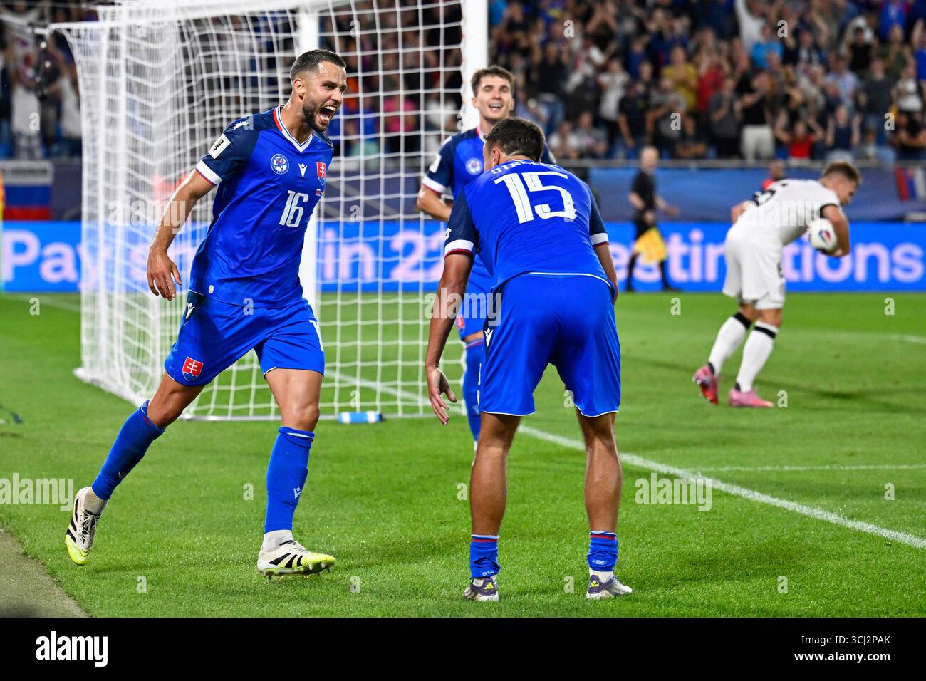 Slovakia's David Hancko, left, celebrates after scoring the opening ...