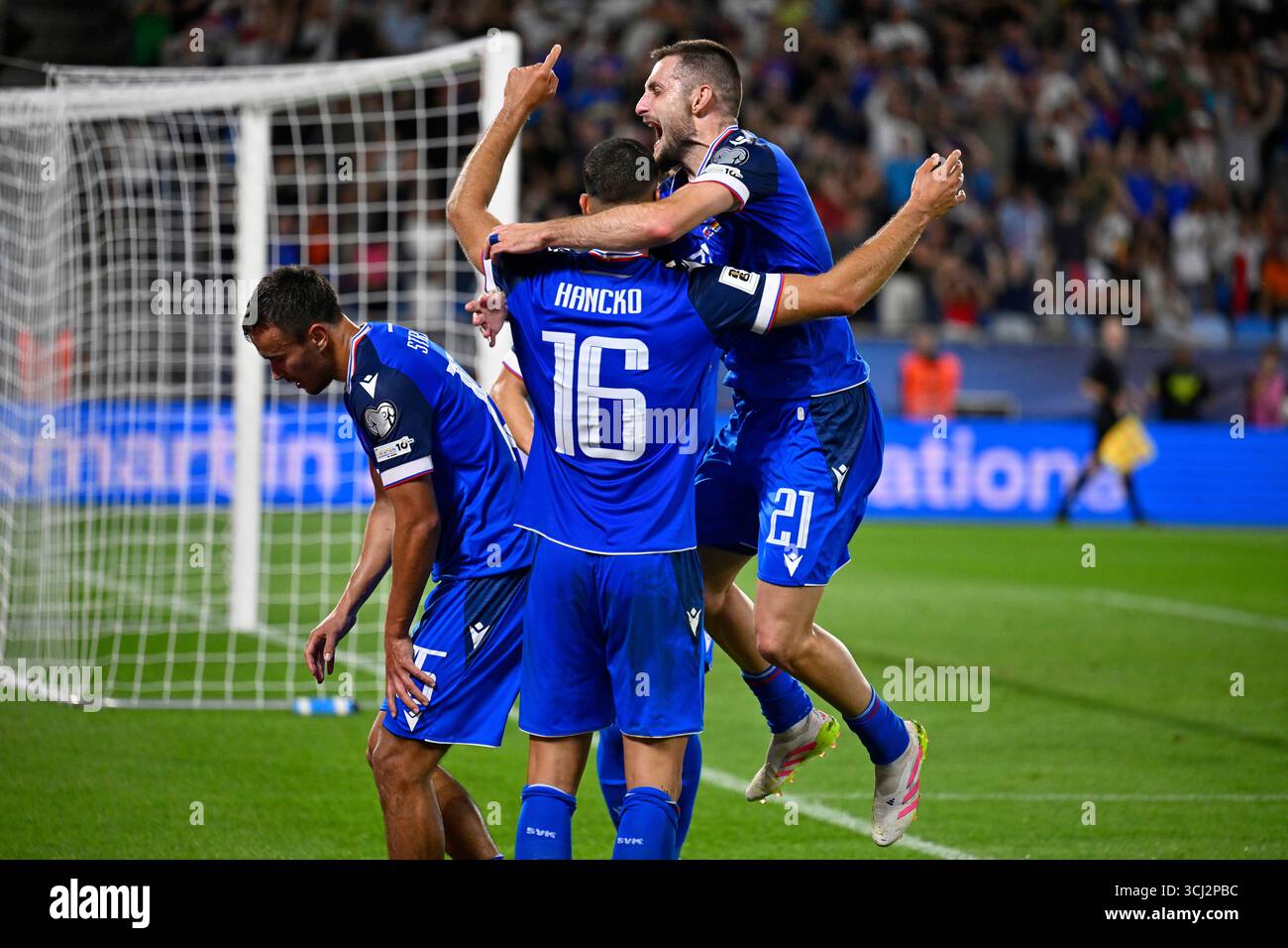Slovakia's David Hancko celebrates with teammates after scoring the ...