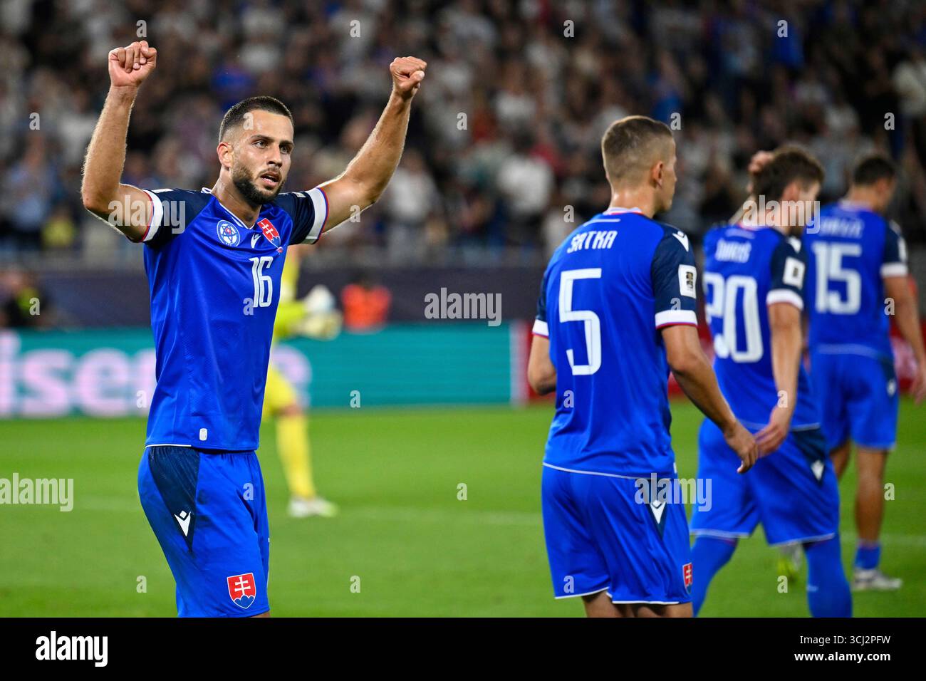 Slovakia's David Hancko, left, celebrates after scoring the opening ...