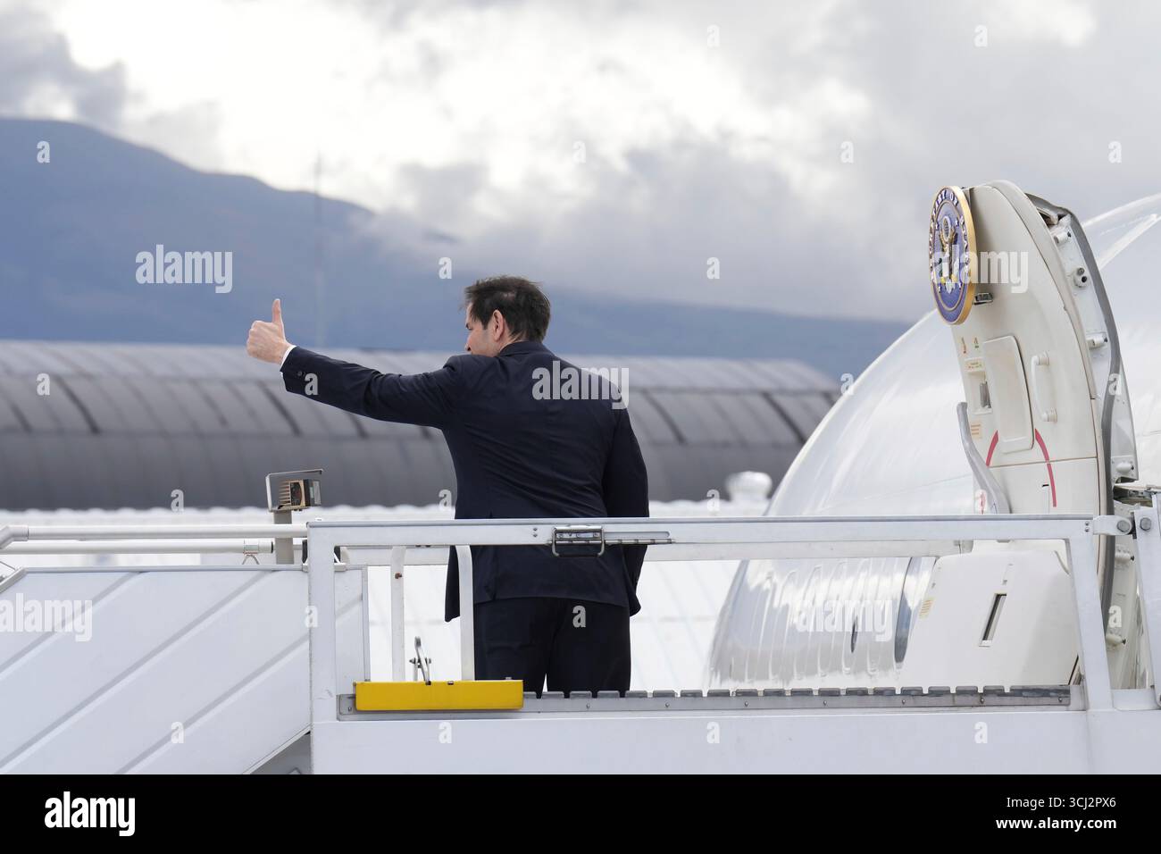 Secretary of State Marco Rubio flashes a thumbs up as he boards his ...
