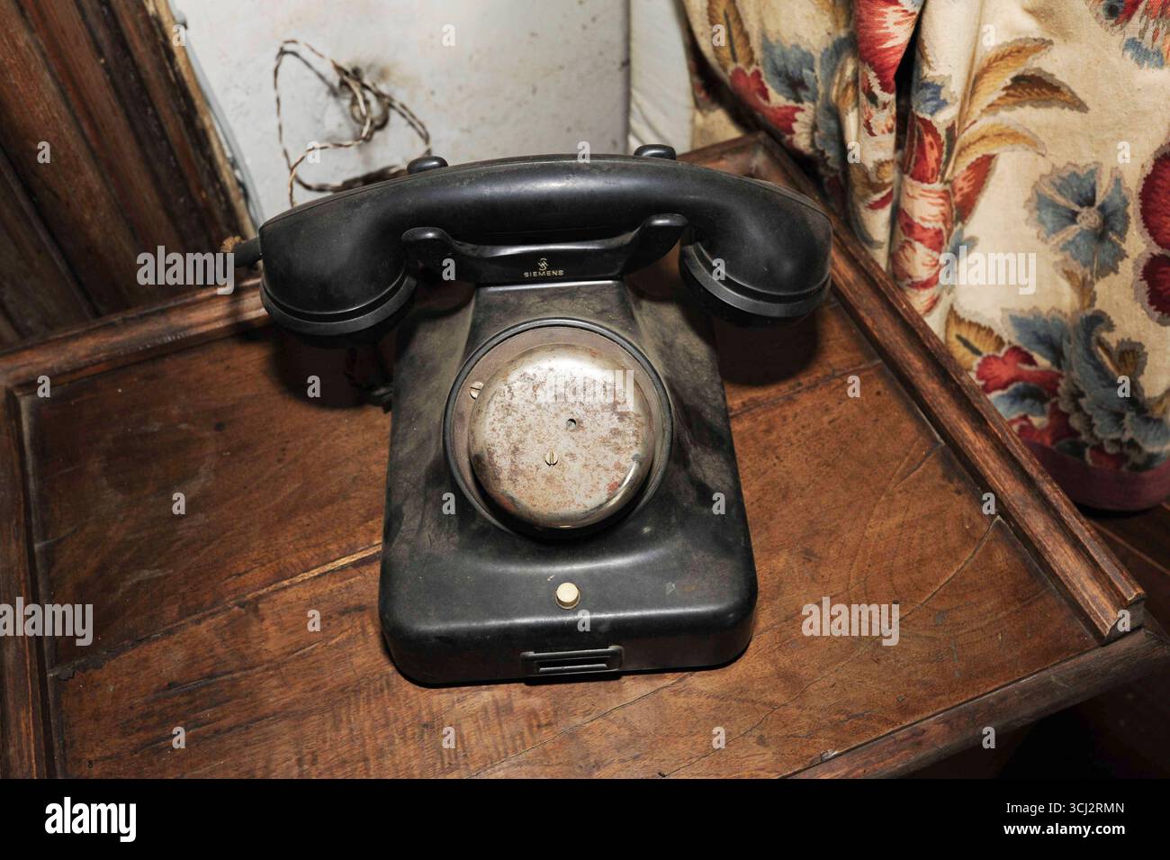 a vintage landline telephone for calling, retro phone set on a table a ...