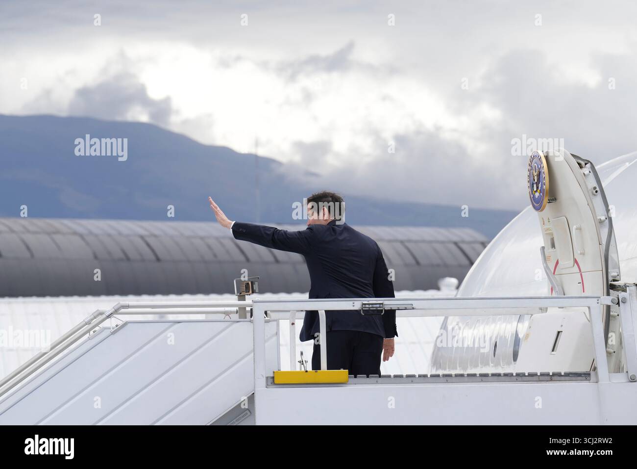Secretary of State Marco Rubio waves as he boards his plane in Quito ...