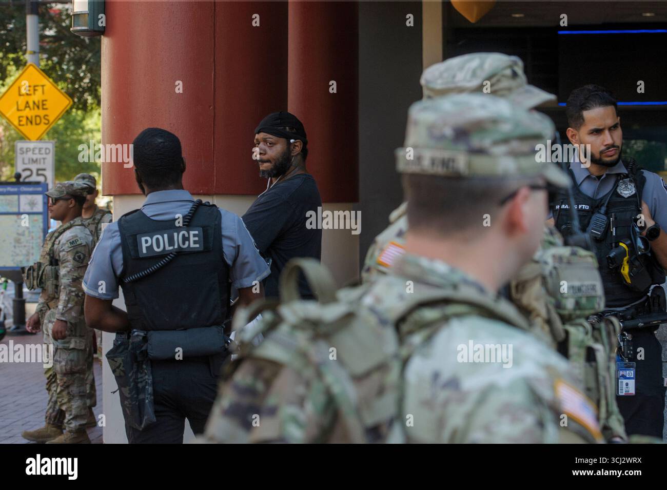 Members of the Mississippi National Guard watch as Metro Transit Police ...