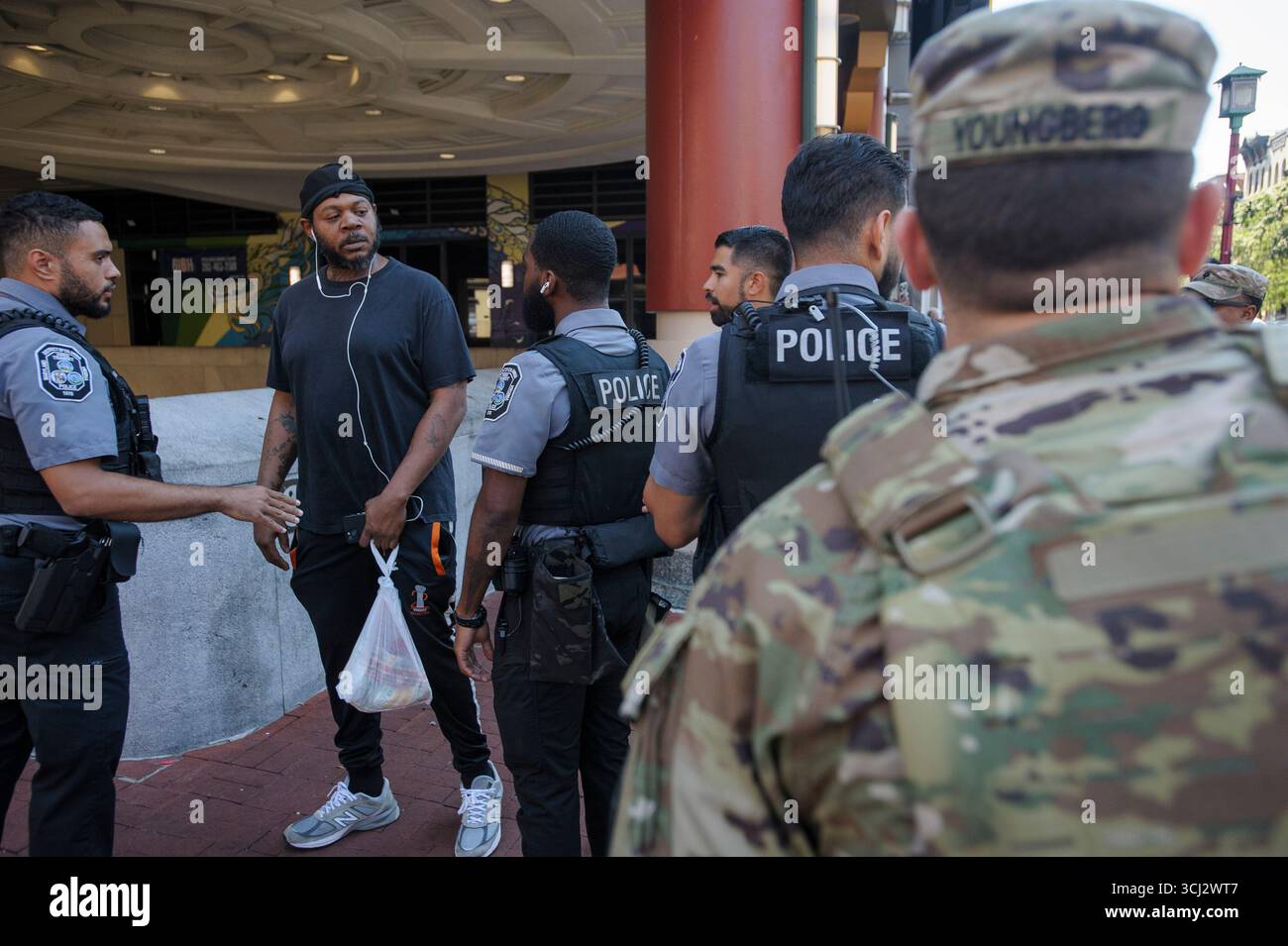 Members of the Mississippi National Guard watch as Metro Transit Police ...