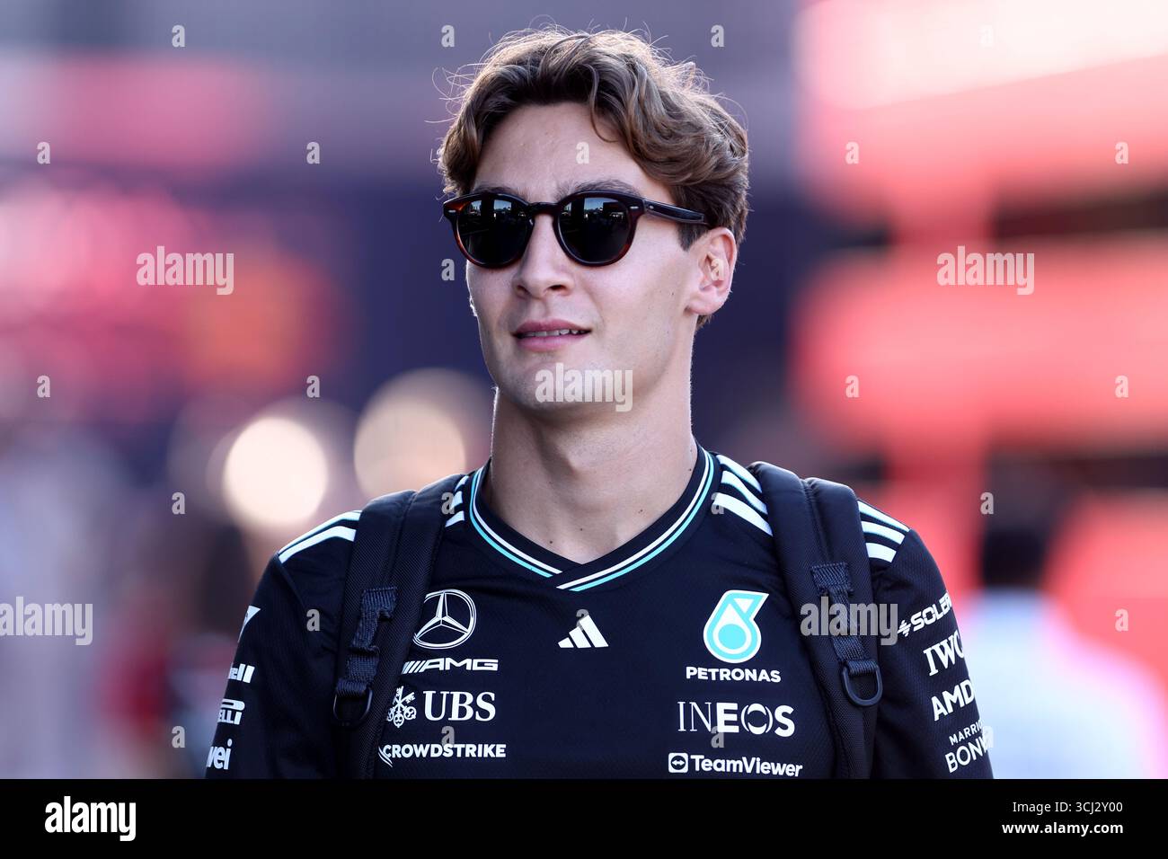 George Russell of Mercedes-AMG F1 Team looks on in the Paddock during ...