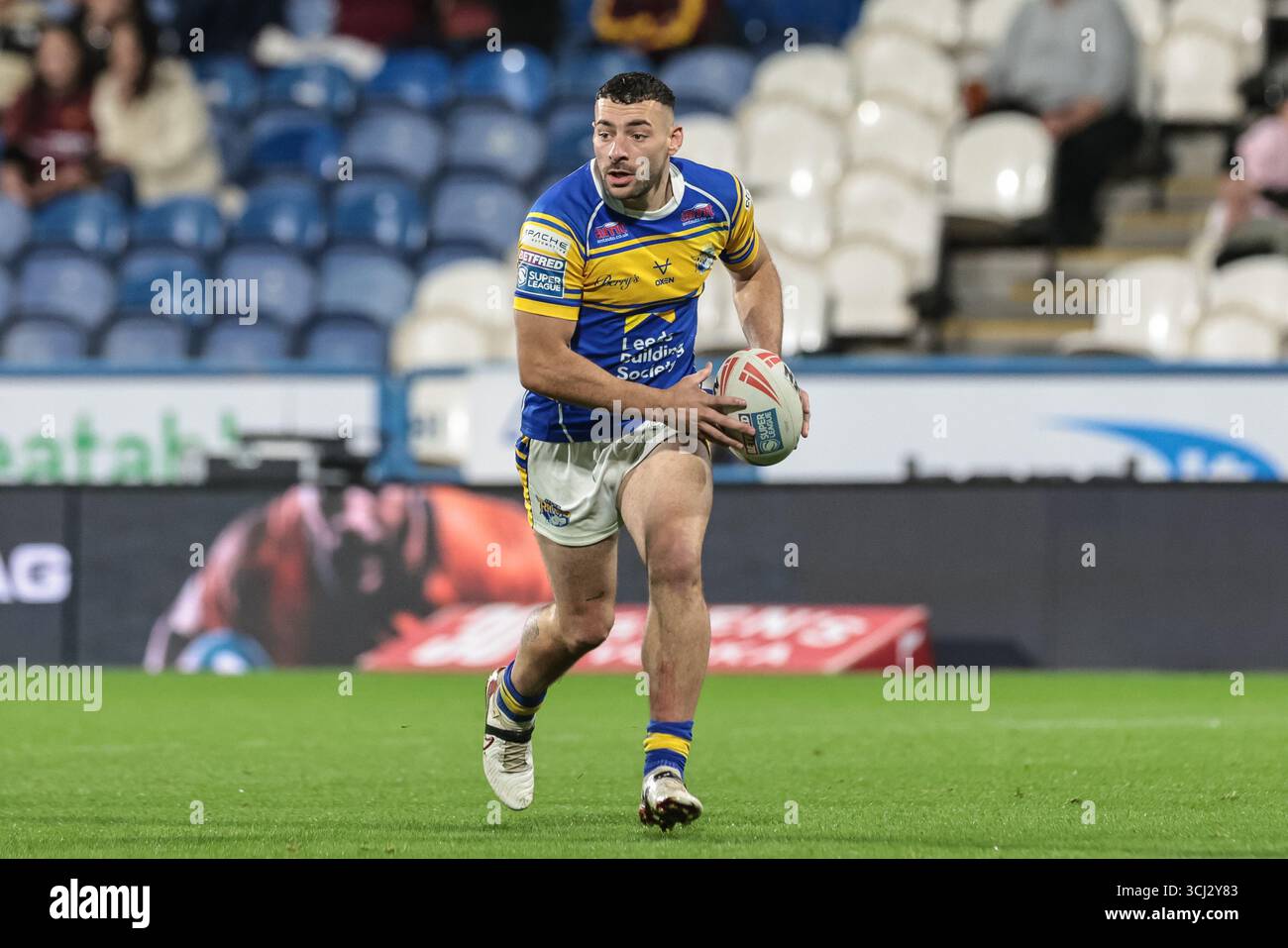 Jake Connor of Leeds Rhinos breaks with the ball during the Betfred ...