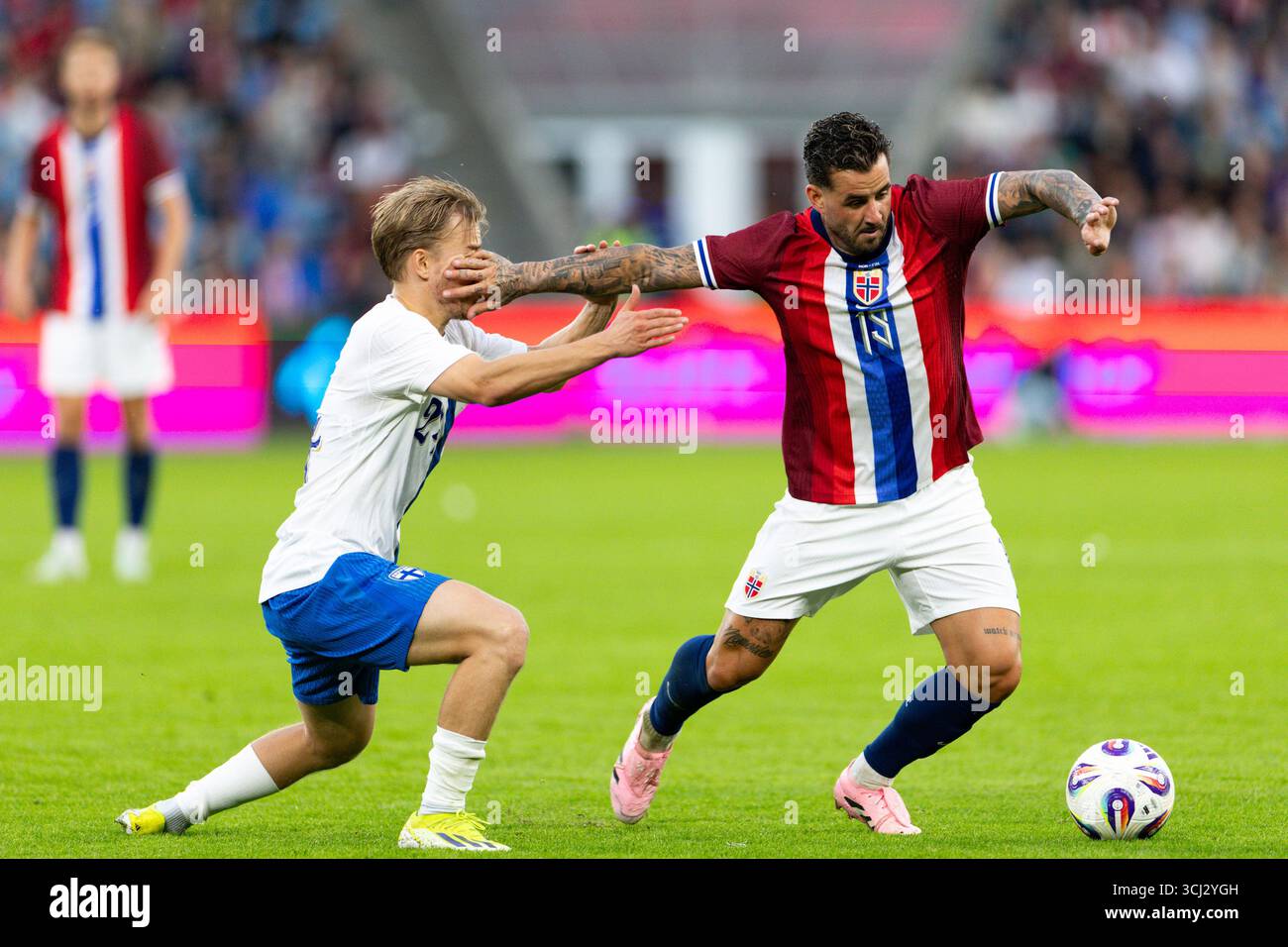 Aron Leonard Bizet Donnum (19 Norway) battle for the ball during the ...