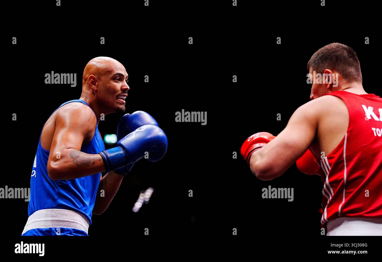 Isaac Okoh (left) in action against Sagyndyk Togambay in their Men's ...