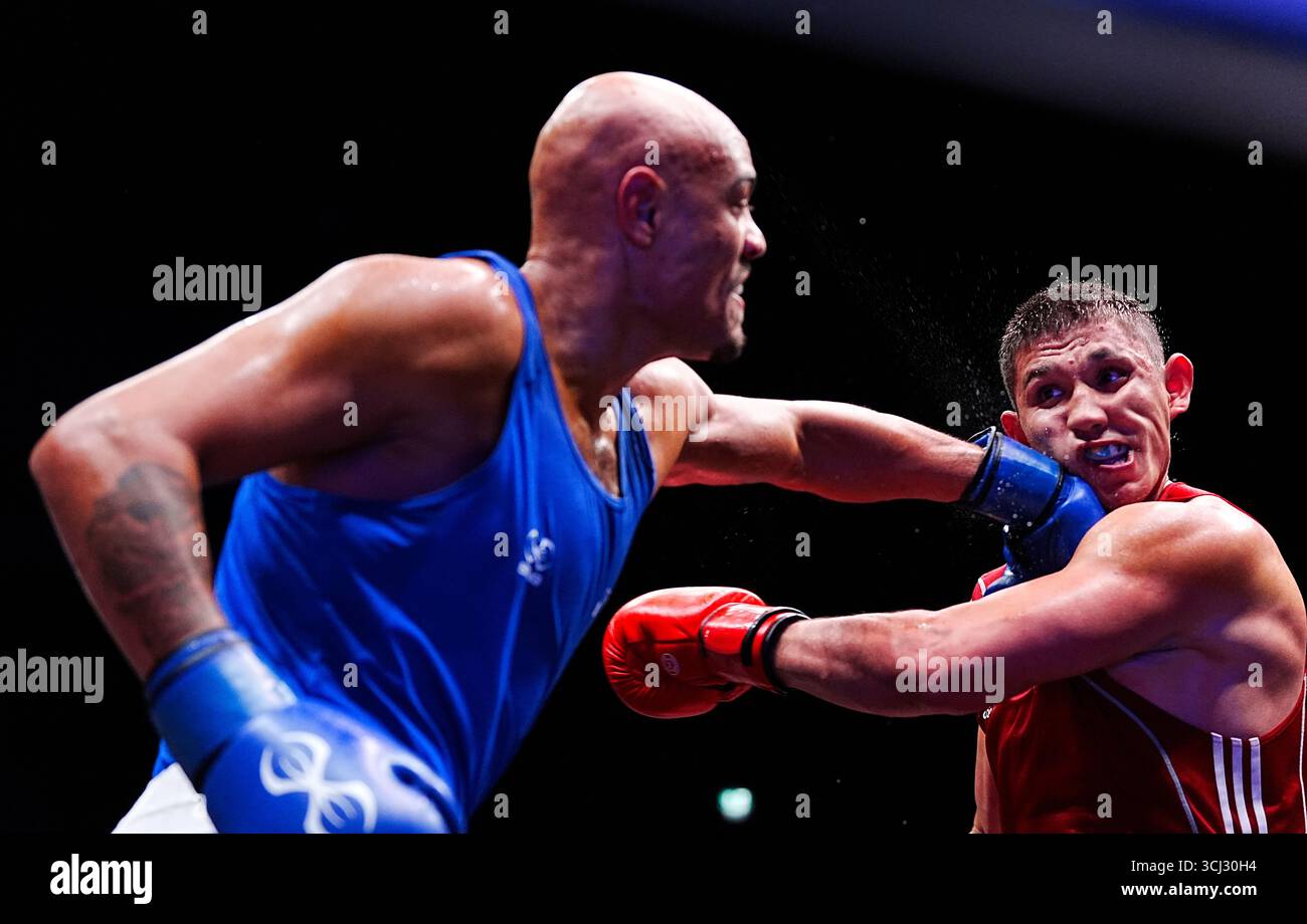 Isaac Okoh (left) in action against Sagyndyk Togambay in their Men's ...