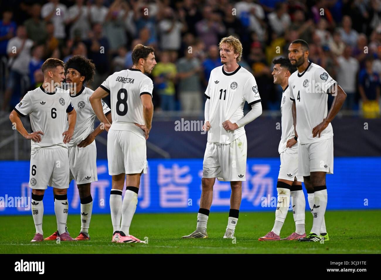 German players stand on the pitch after losing the World Cup Group A ...