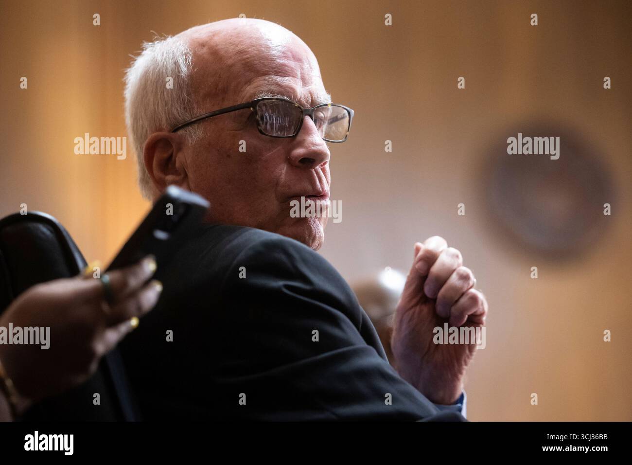 Sen. Peter Welch (D-Vt.) confers with an aide before questioning Health ...