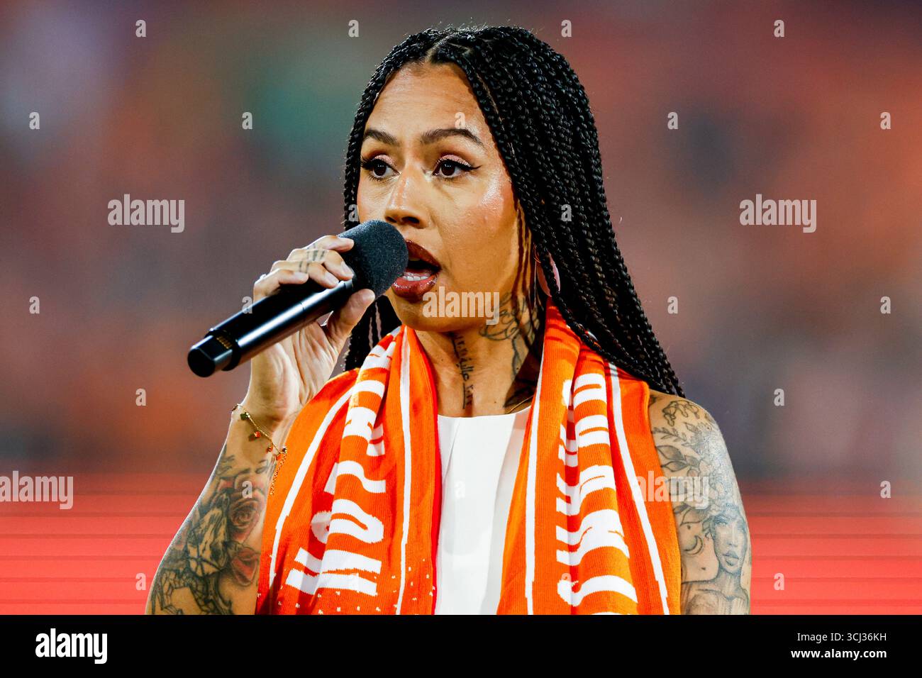 singer Tabitha of the Netherlands sings the national anthem during the ...