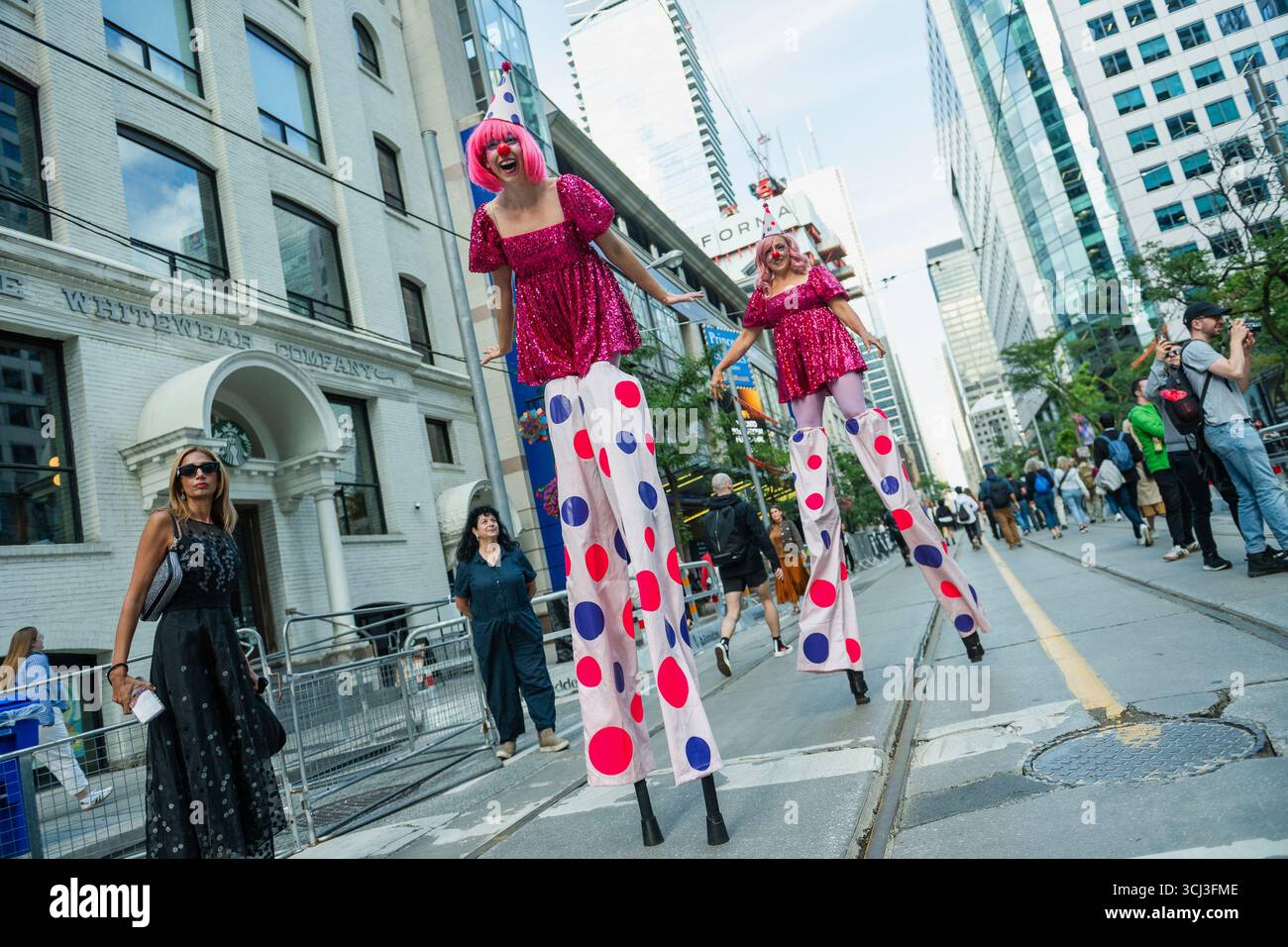 Performers on stilts pose for a photo at the Toronto International Film ...