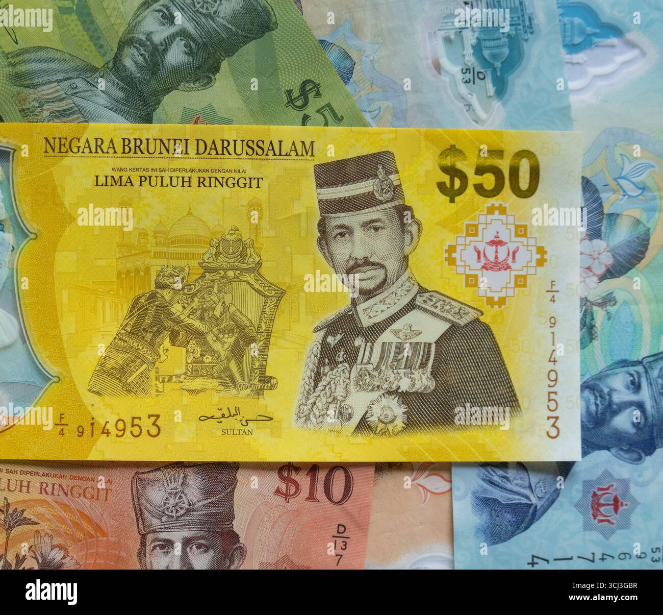Examples of Brunei dollar notes, equivalent to Singapore dollars Stock ...