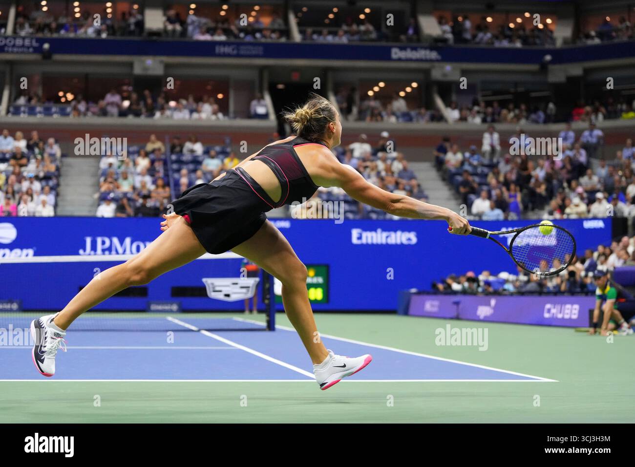 Aryna Sabalenka, of Belarus, reaches to returns a shot to Jessica ...