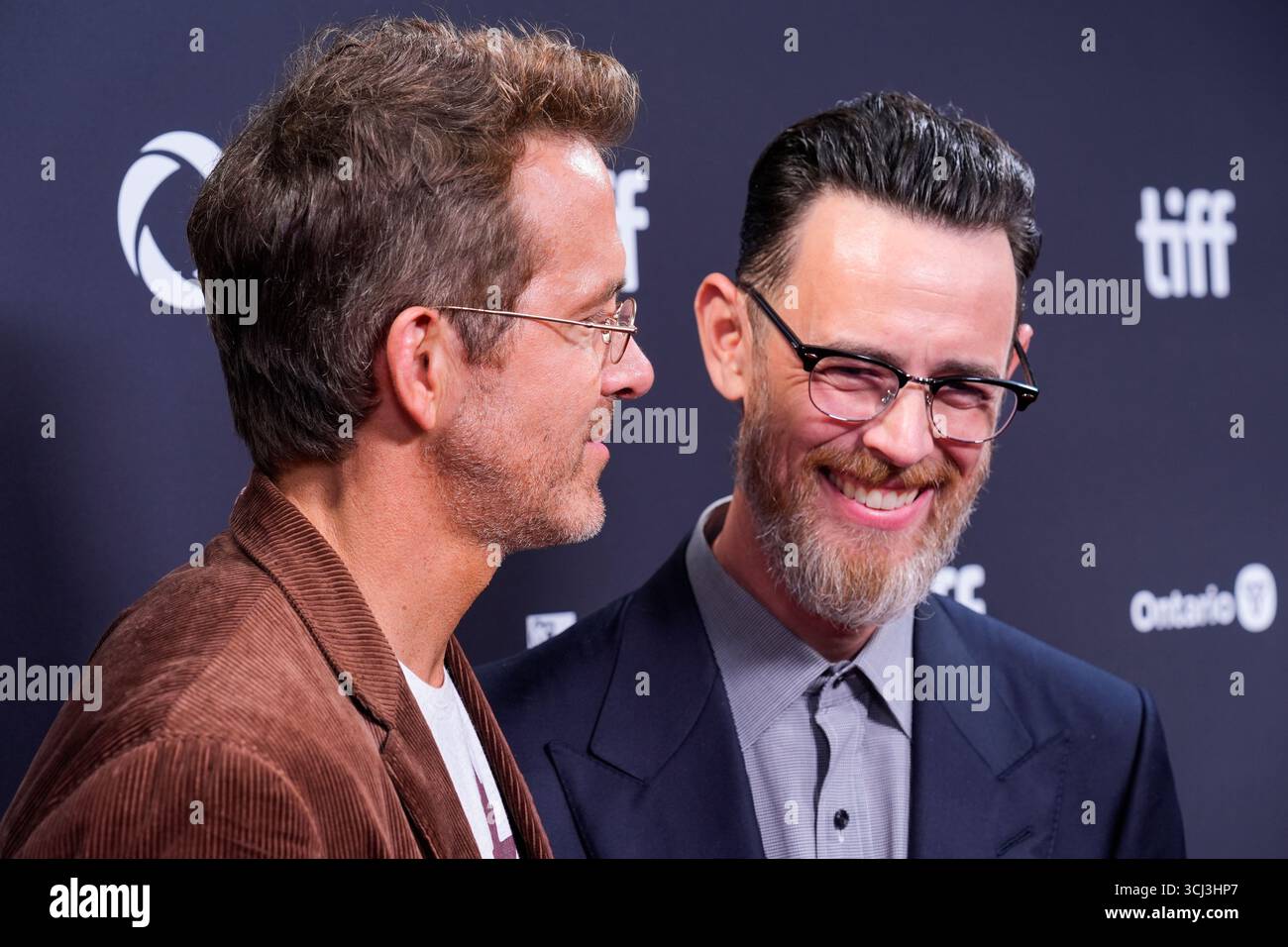 Ryan Reynolds, left, and director Colin Hanks attend the premiere of ...