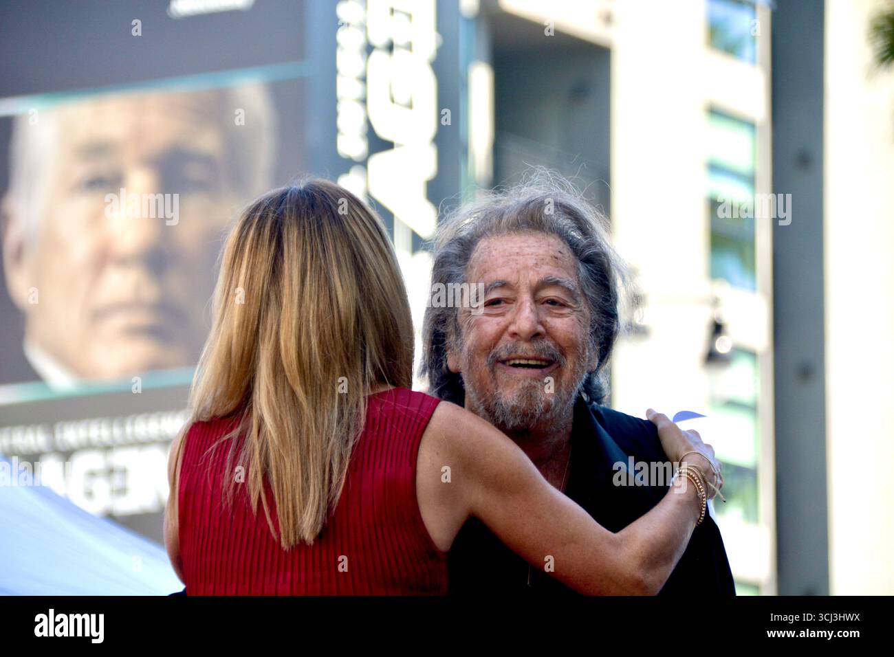 Actor Al Pacino shares a hug with emcee Kit Hoover during Jessica ...