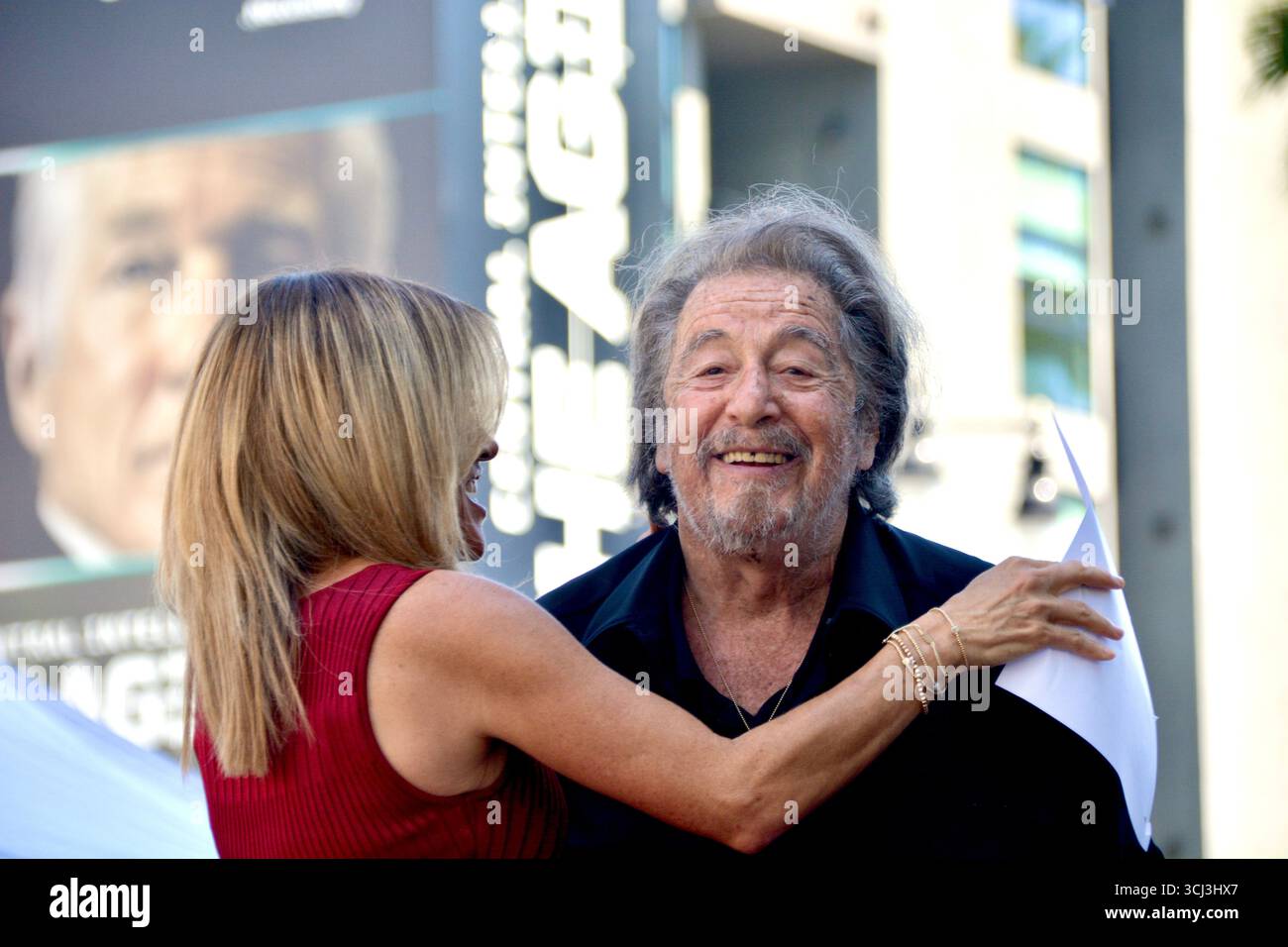 Actor Al Pacino shares a hug with emcee Kit Hoover during Jessica ...