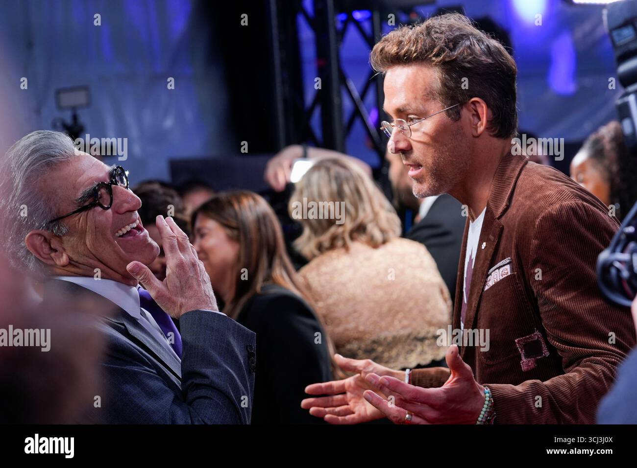 Eugene Levy, left, and Ryan Reynolds attend the premiere of "John Candy ...