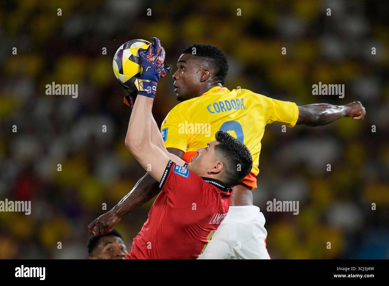 Bolivia's goalkeeper Carlos Lampe catches the ball challenged by ...