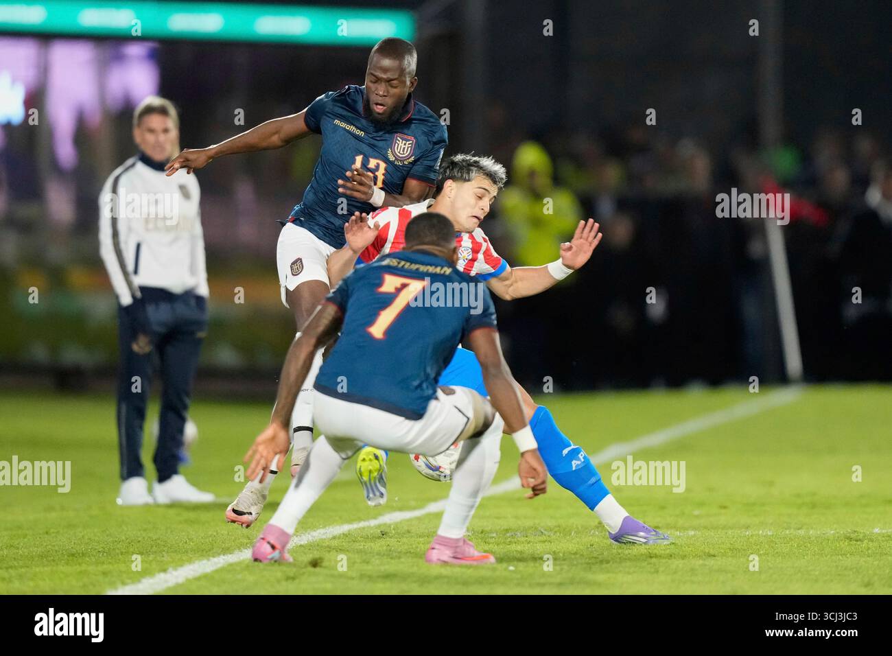 Paraguay's Ramon Sosa, center, and Ecuador's Enner Valencia, back, and Pervis Estupinan battle ...