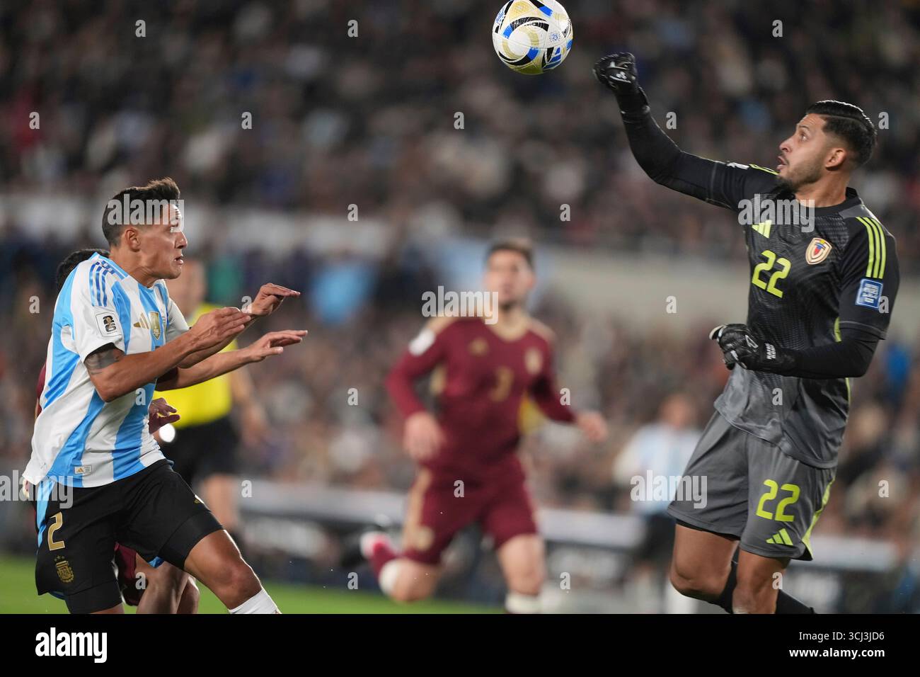 Venezuela's goalkeeper Rafael Romo blocks an attack of Argentina's ...