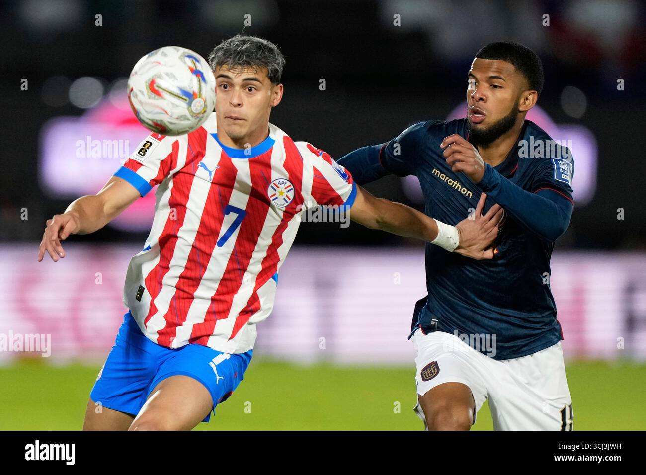 Paraguay's Ramon Sosa, left, and Ecuador's Pedro Vite battle for the ball during a World Cup ...