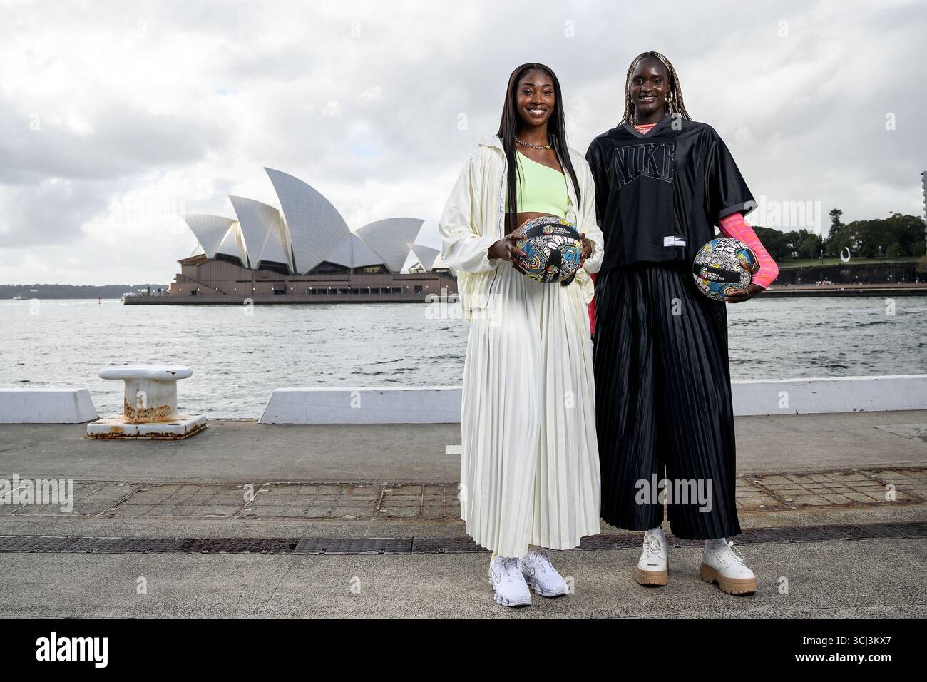 Jamaican netball player Shimona Jok (left), and Ugandan player Mary ...