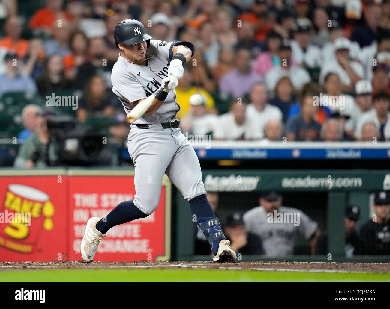 New York Yankees' Anthony Volpe (11) singles against Houston Astros ...
