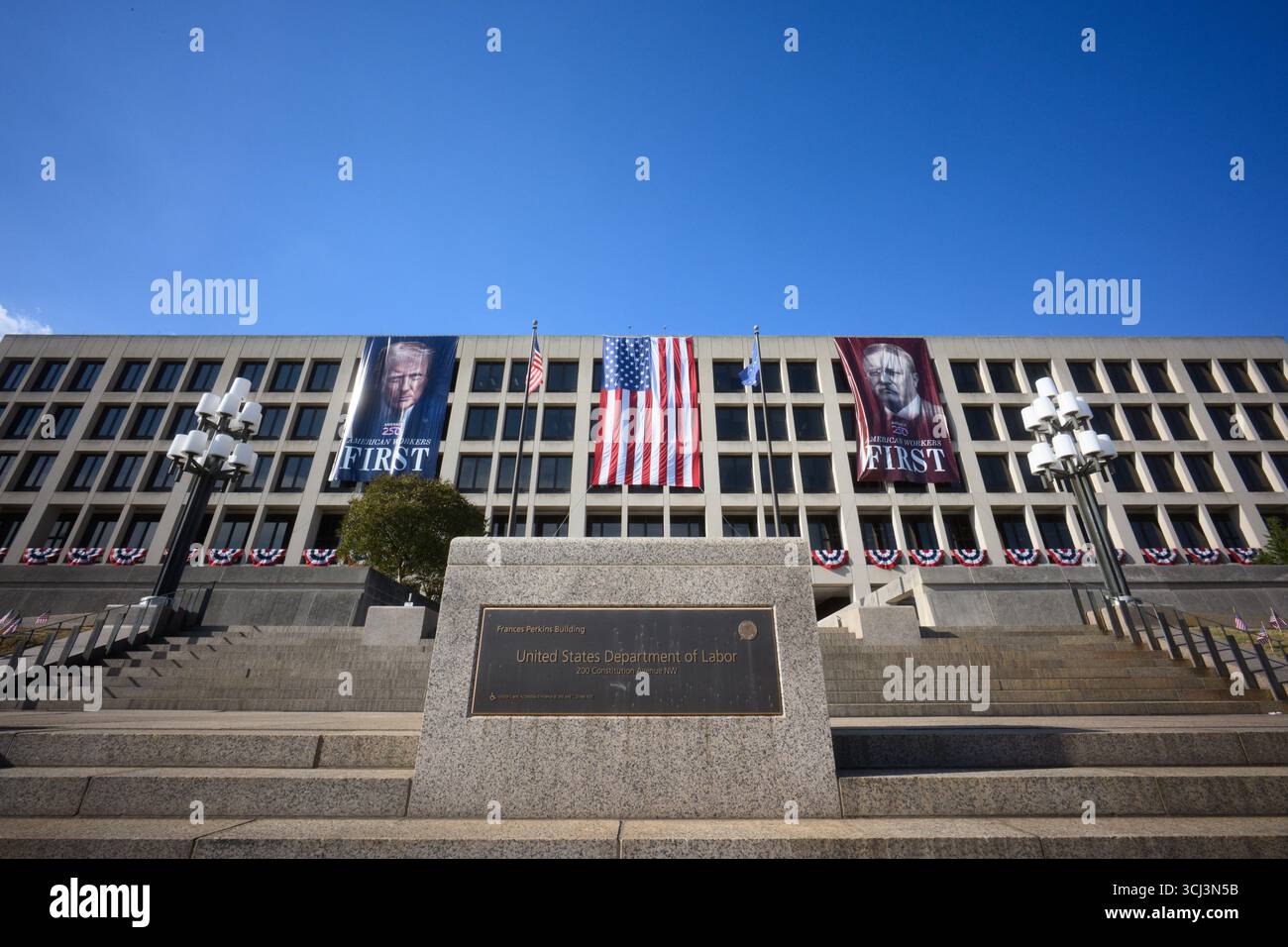 Banners with portraits of President Donald Trump and former president ...