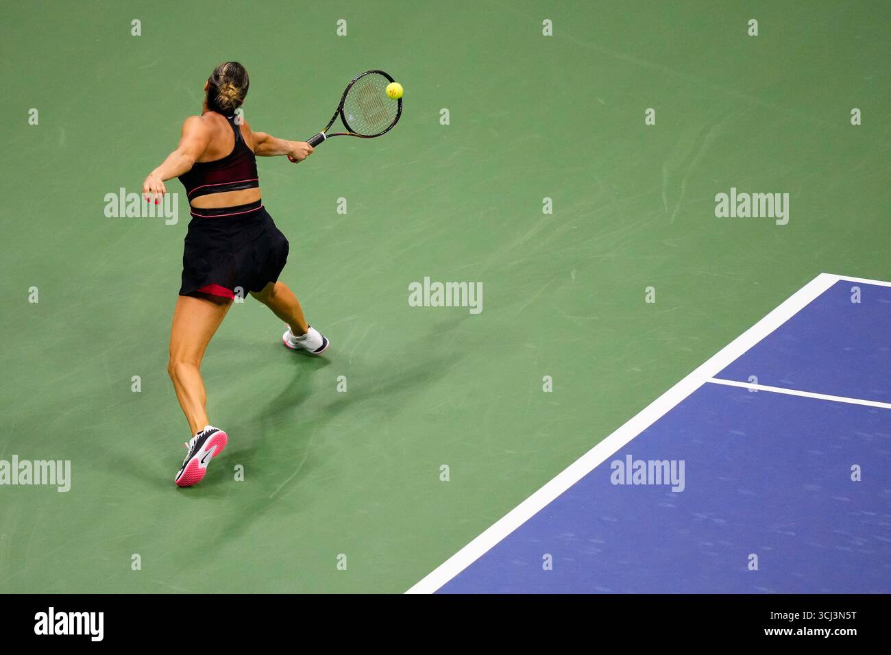 Aryna Sabalenka, of Belarus, returns a shot to Jessica Pegula, of the ...