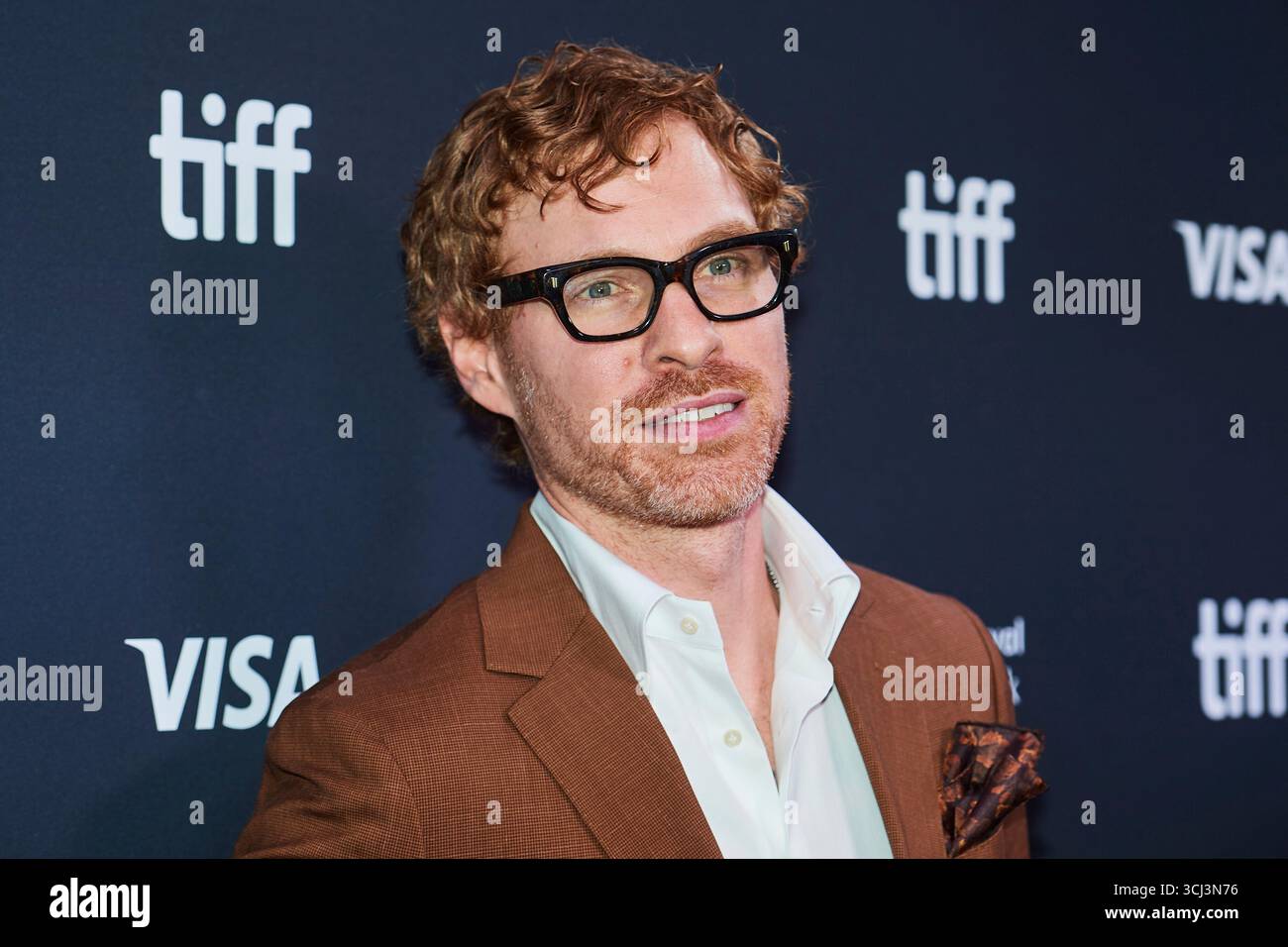 Composer Tyler Strickland is photographed on the red carpet for the film "John Candy: I Like Me ...