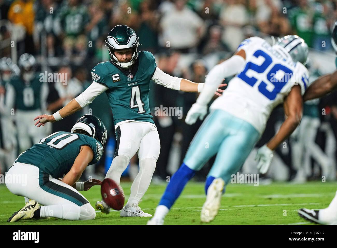 Philadelphia Eagles place kicker Jake Elliott (4) kicks an extra point ...