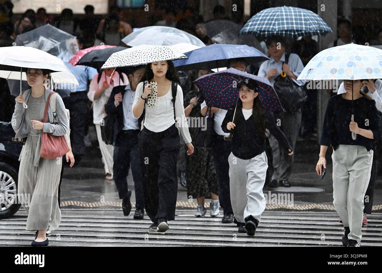 People walking in the occasional heavy rain in Chiyoda,Tokyo Japan, on ...