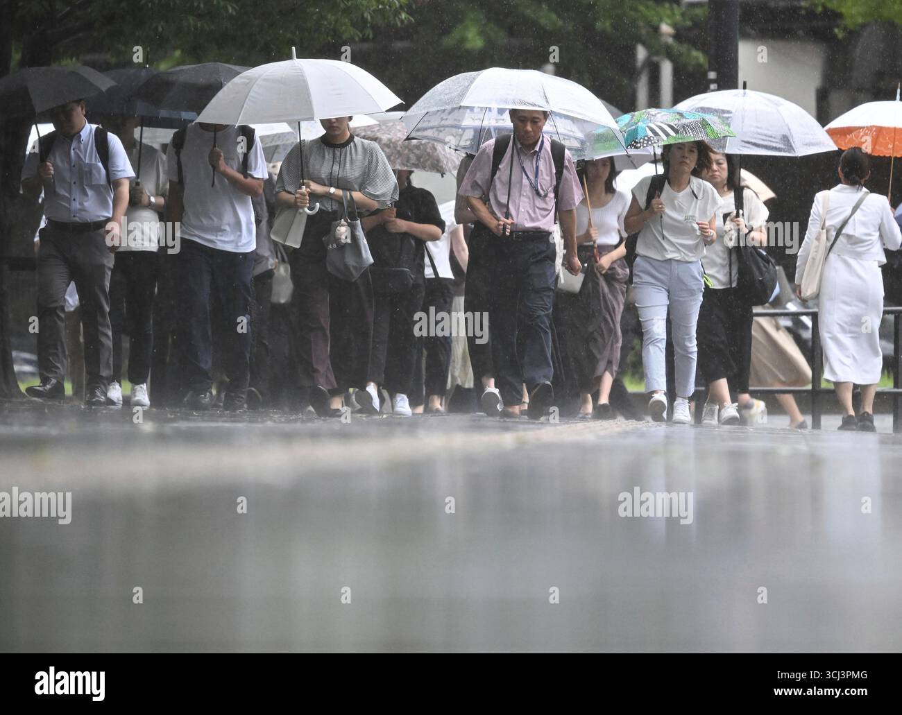People walking in the occasional heavy rain in Chiyoda,Tokyo Japan, on ...