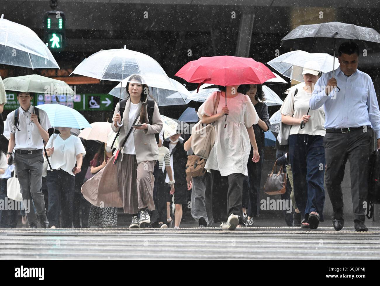 People walking in the occasional heavy rain in Chiyoda,Tokyo Japan, on ...