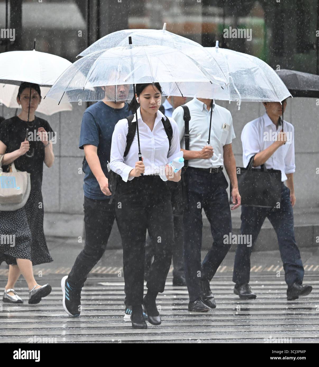 People walking in the occasional heavy rain in Chiyoda,Tokyo Japan, on ...