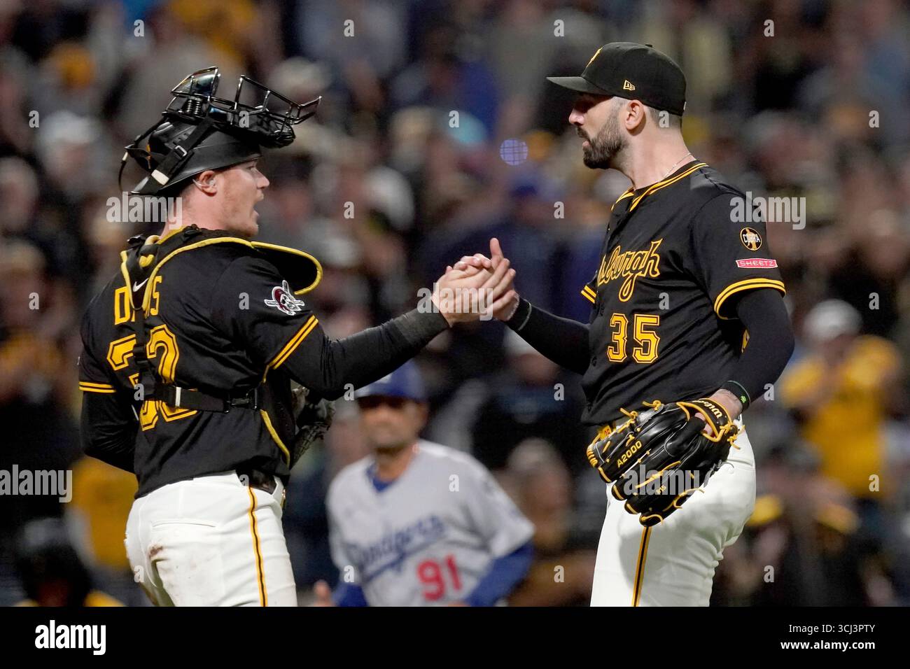Pittsburgh Pirates pitcher Colin Holderman, right, celebrates with ...