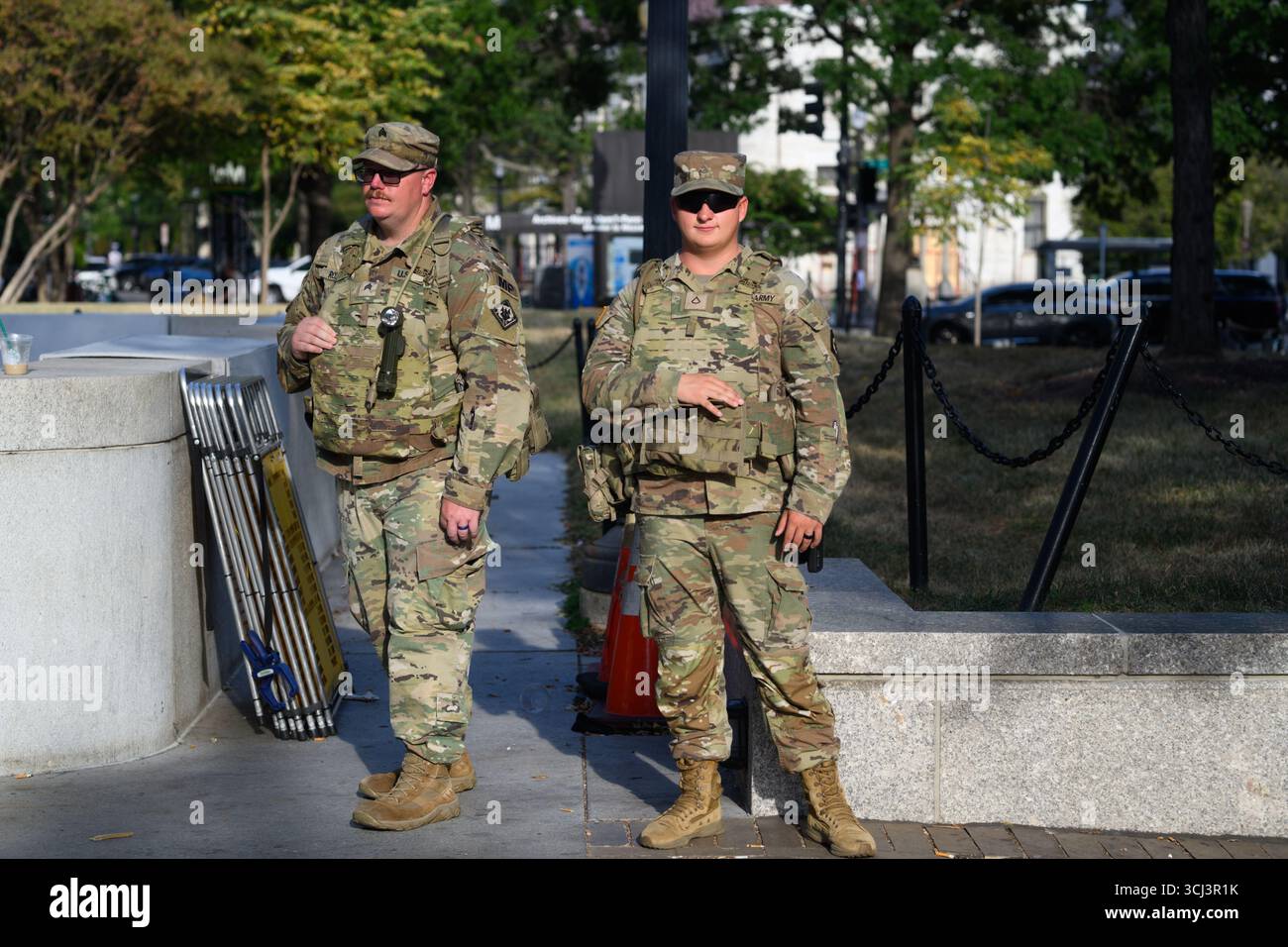 Members of the Army National Guard stand outside a subway station in ...