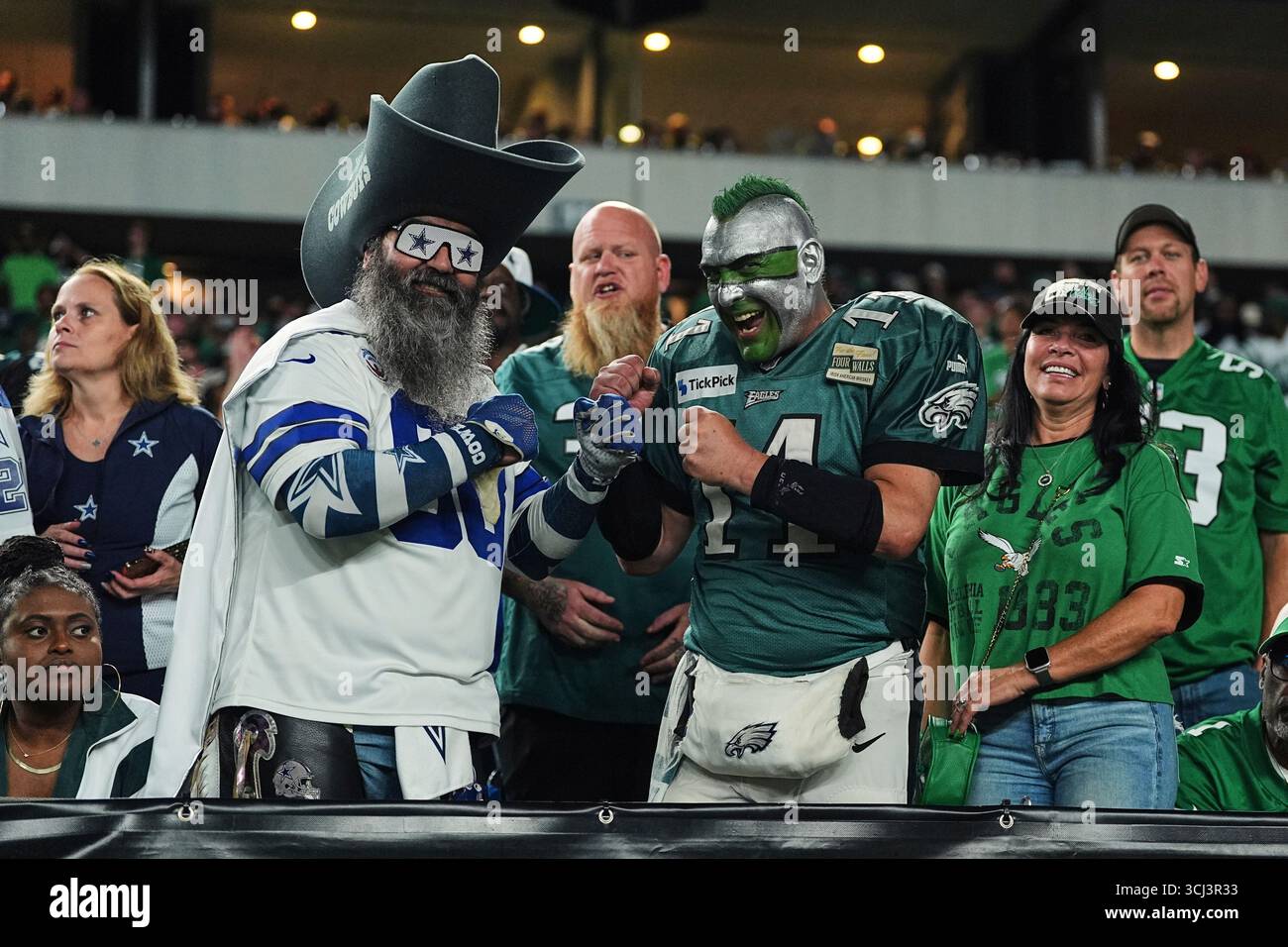 A Dallas Cowboys fan and a Philadelphia Eagles fan pose for a photo ...