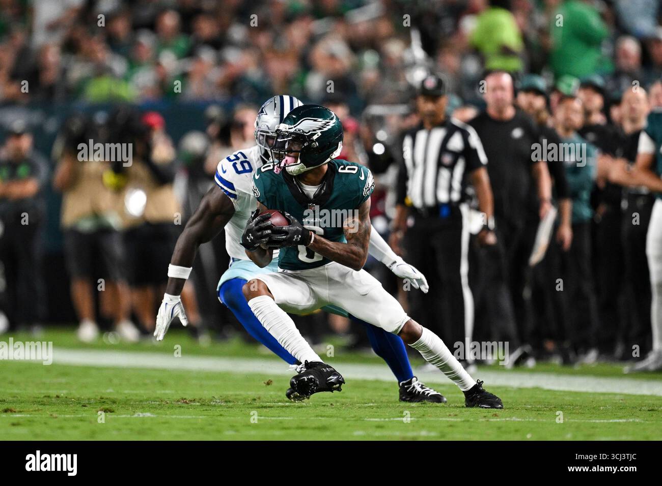 Philadelphia Eagles wide receiver DeVonta Smith (6) runs with the ball after catching a pass ...