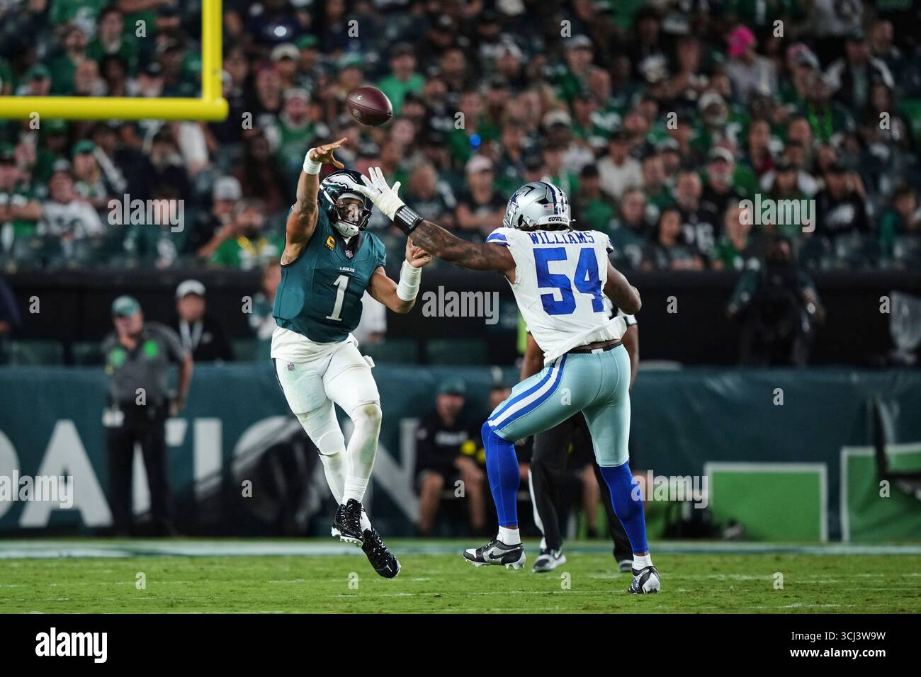 Philadelphia Eagles quarterback Jalen Hurts (1) throws a pass under ...