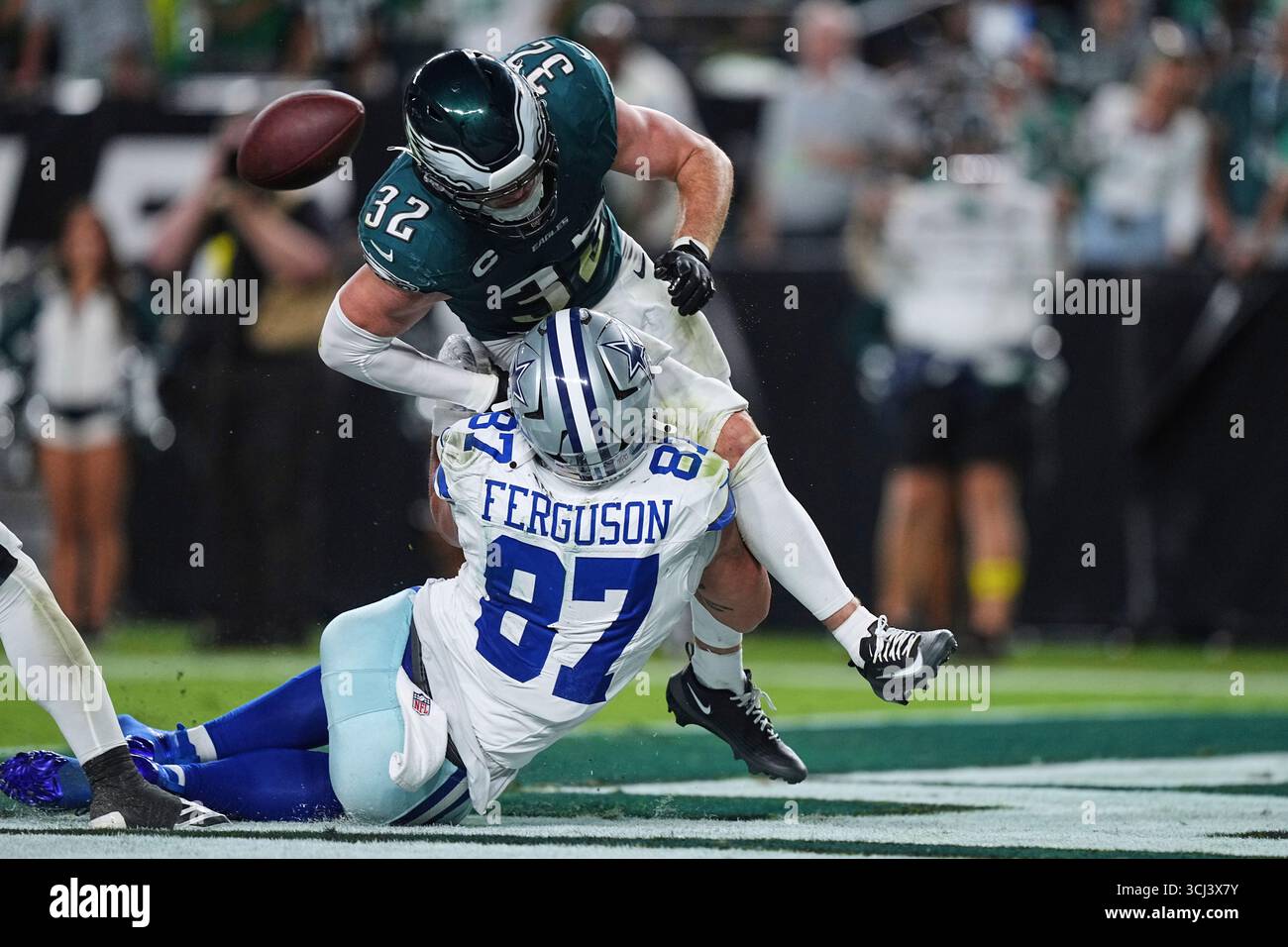 Dallas Cowboys tight end Jake Ferguson (87) takes a hit from ...