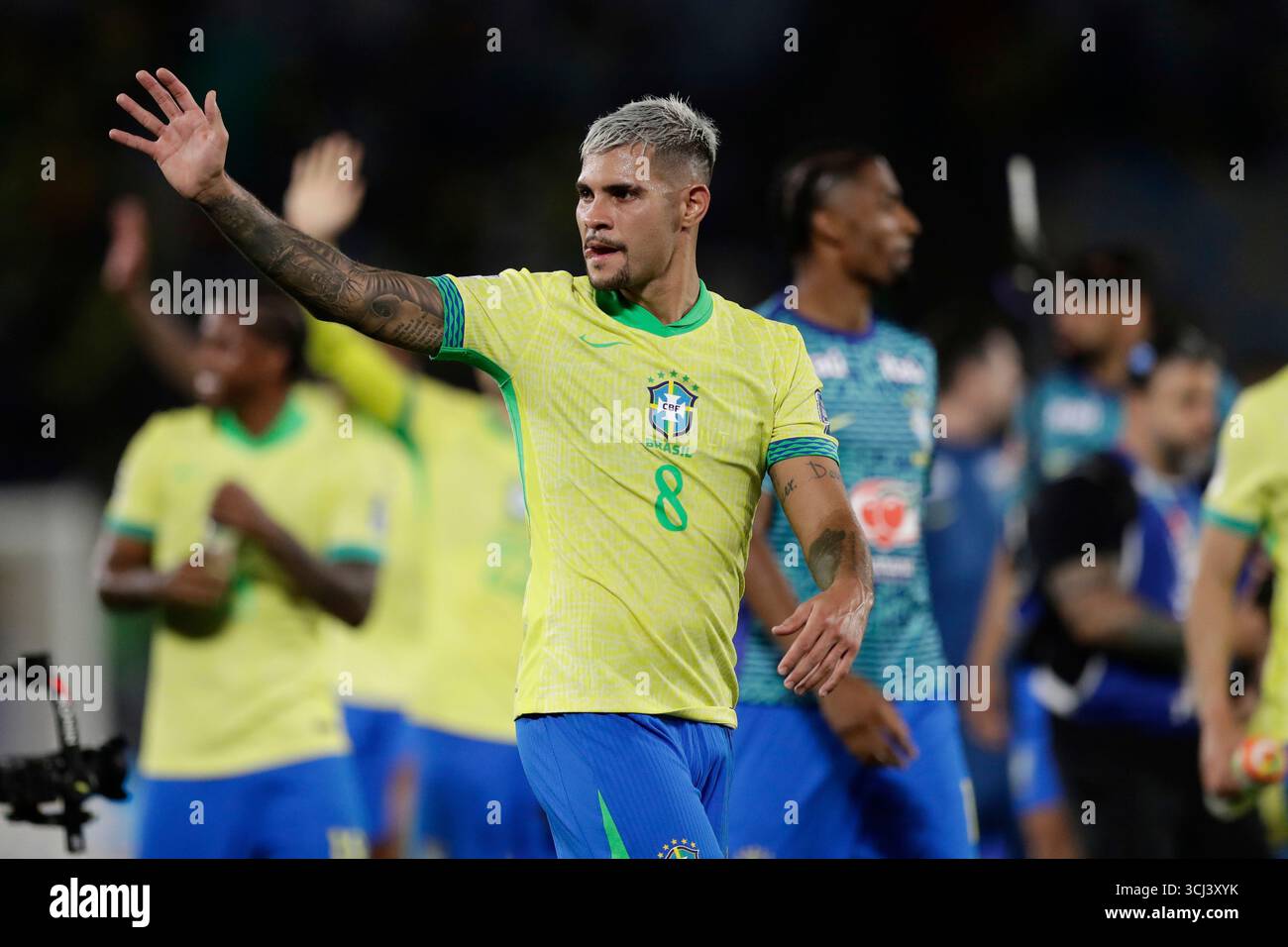 Brazil's players celebrate winning 3-0 against Chile at the end of a ...