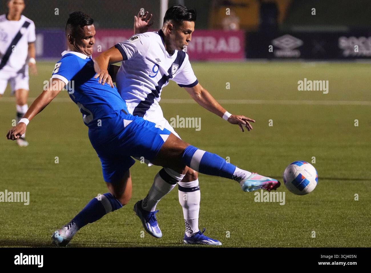 El Salvador's Henry Romero tackles Guatemala's Rubio Rubin during a ...