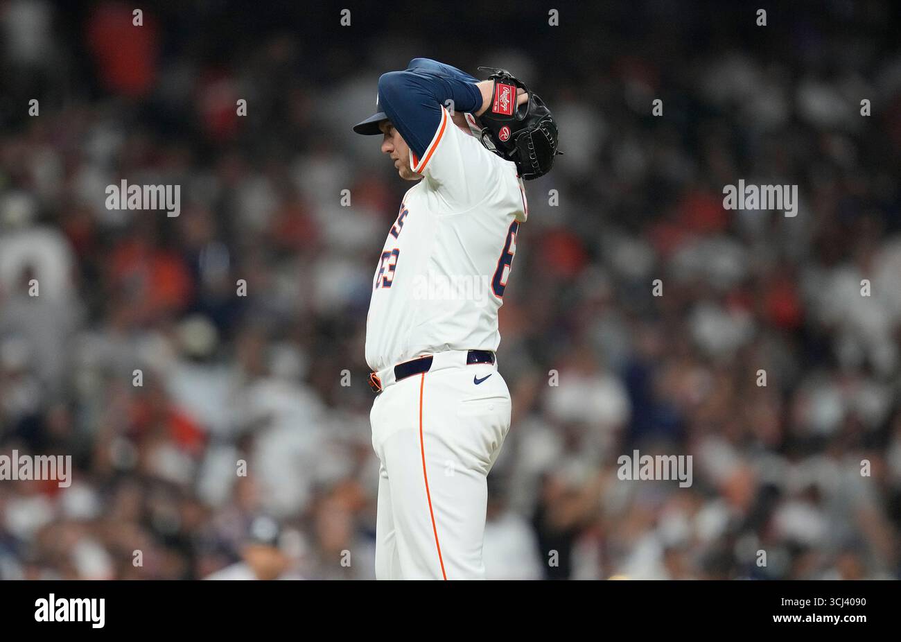 Houston Astros relief pitcher Kaleb Ort reacts after giving up a three ...
