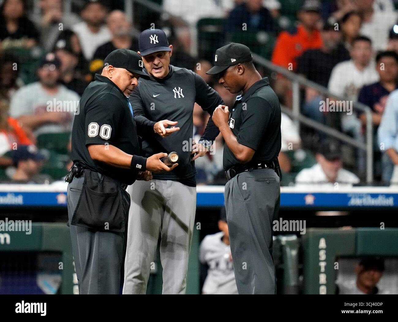 New York Yankees manager Aaron Boone, center, looks at Houston Astros ...
