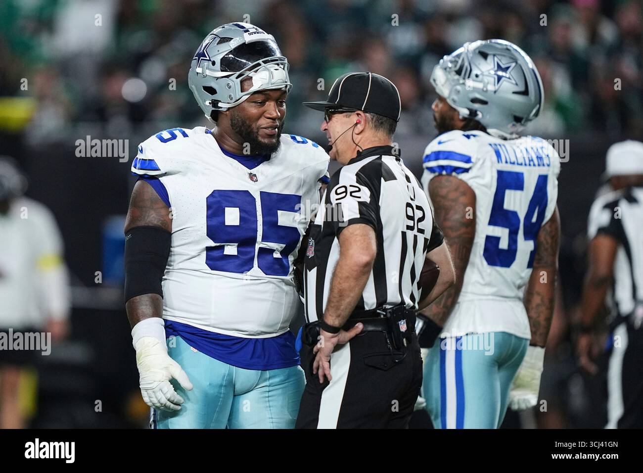 Dallas Cowboys defensive tackle Kenny Clark (95) talks with umpire ...