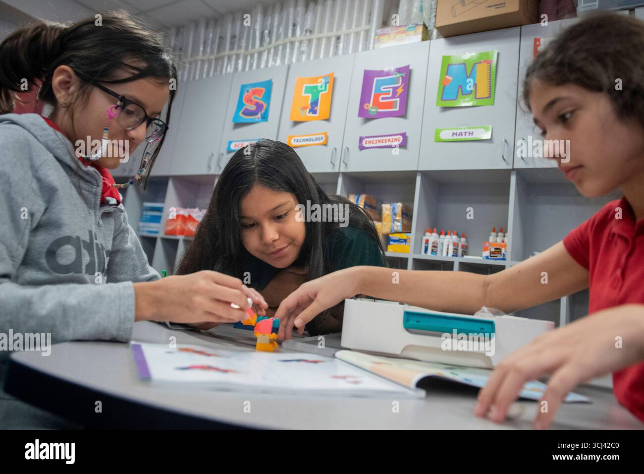 Students build a dragon out of LEGO bricks during class at Lively ...